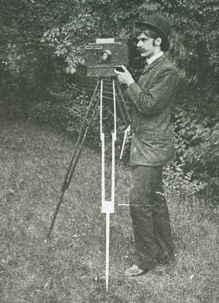 Self-Portrait with Camera, Tripod and Pistol
