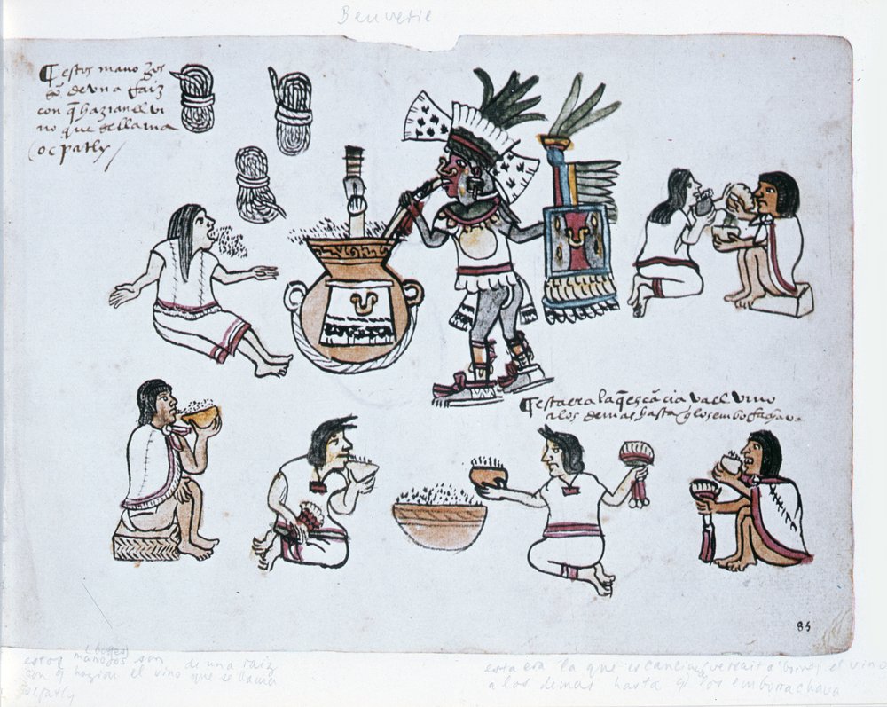 Aztec Pulque Deity blowing on a tube above a jar of pulque and men ...