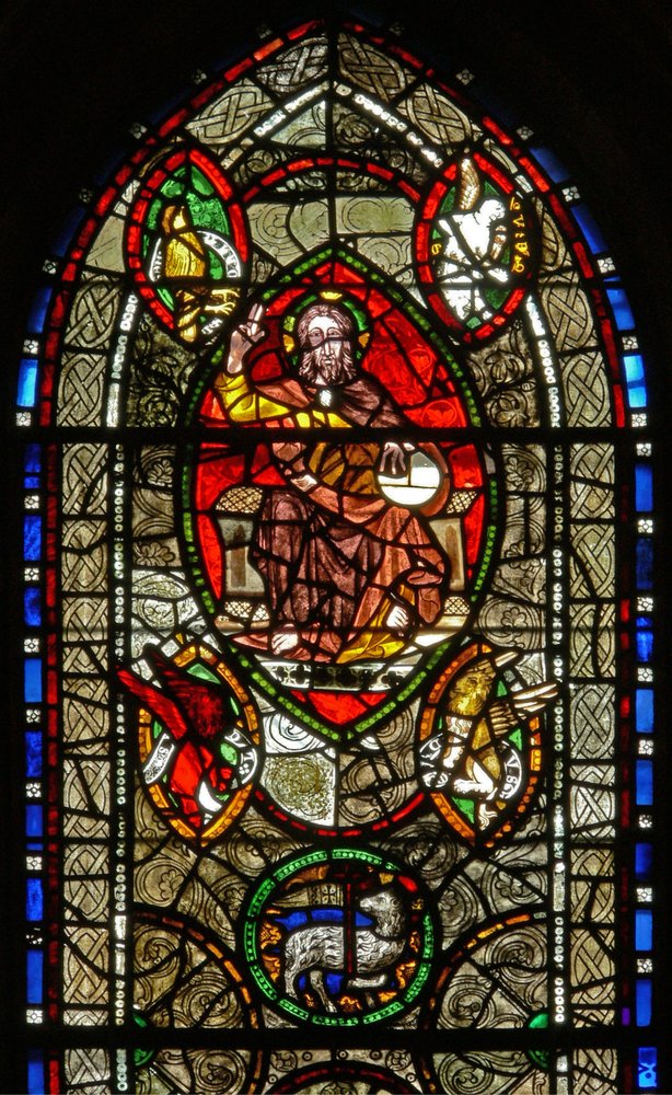 Window depicting Christ in Majesty surrounded by Evangelist symbols