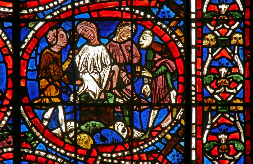 Window depicting Joseph is lowered into the pit