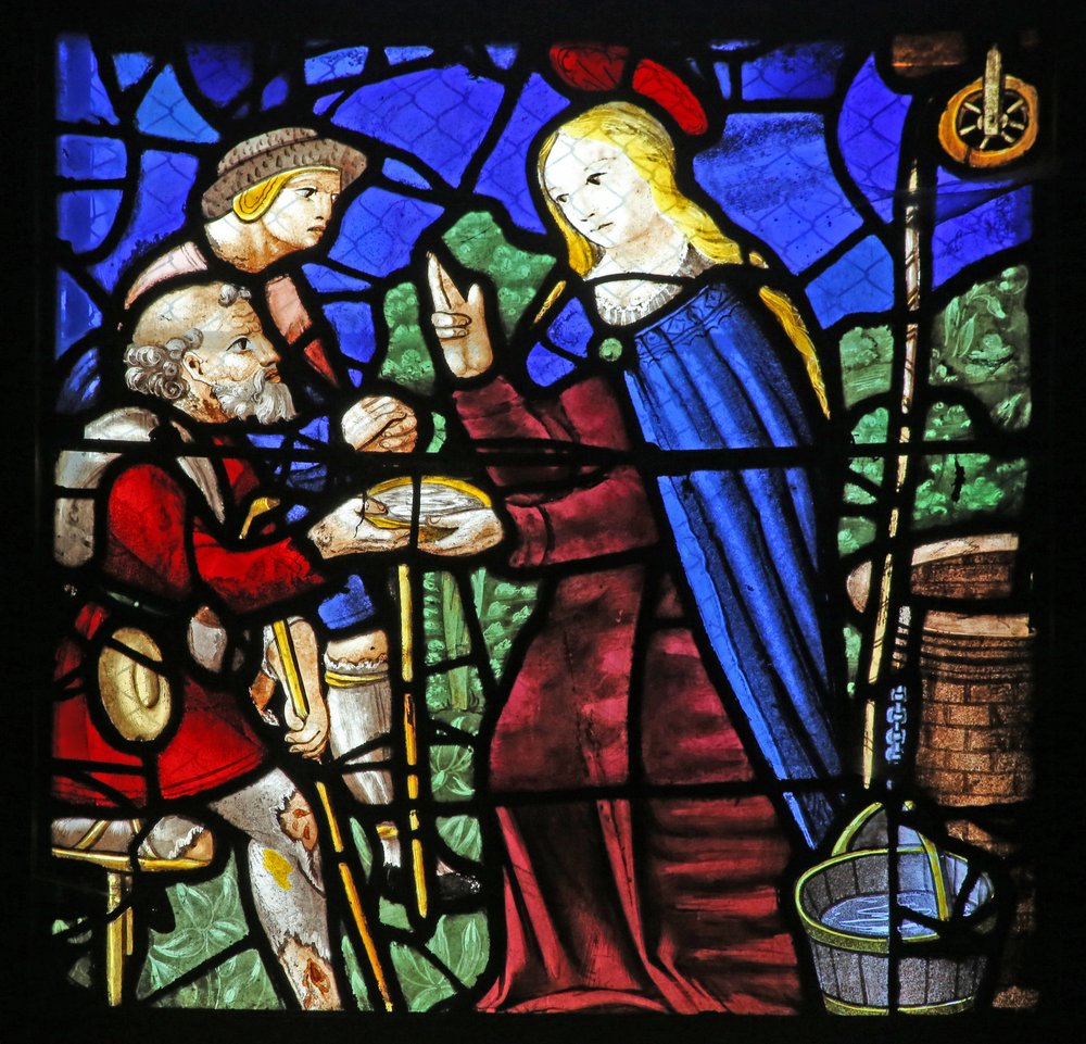 Window depicting St Genevieve gives a leper drink