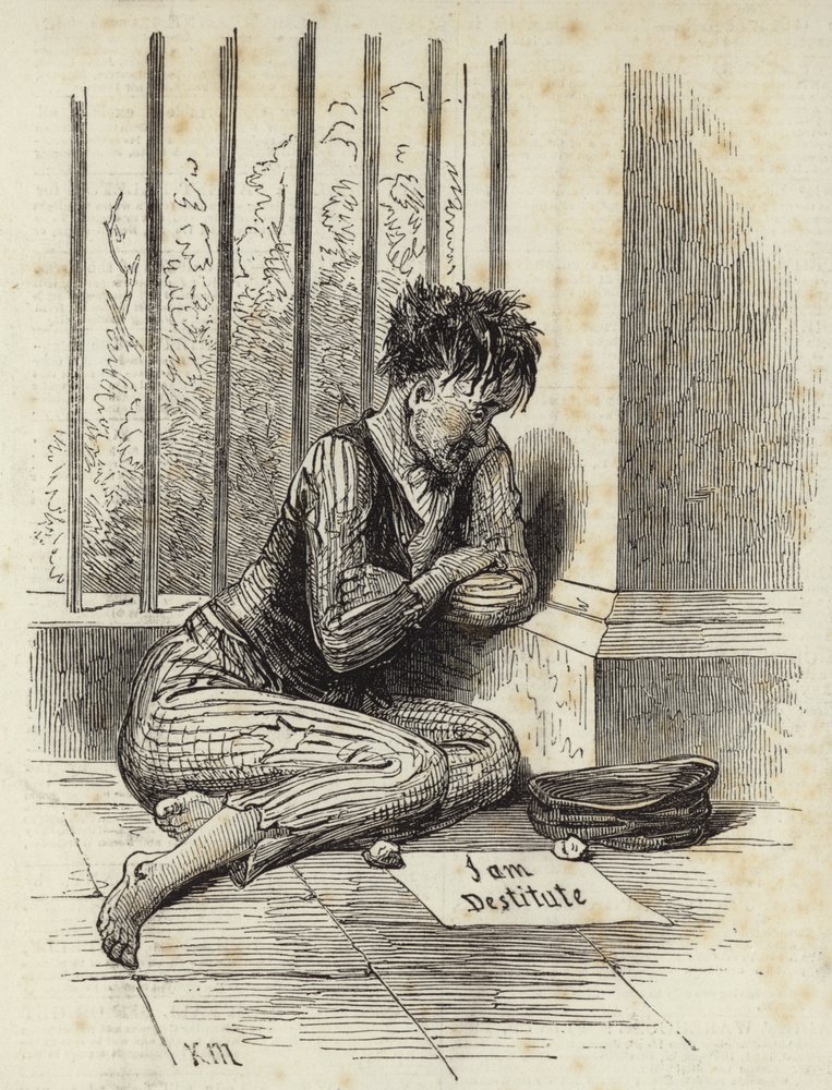 Beggar on the street with a sign reading I am Destitute