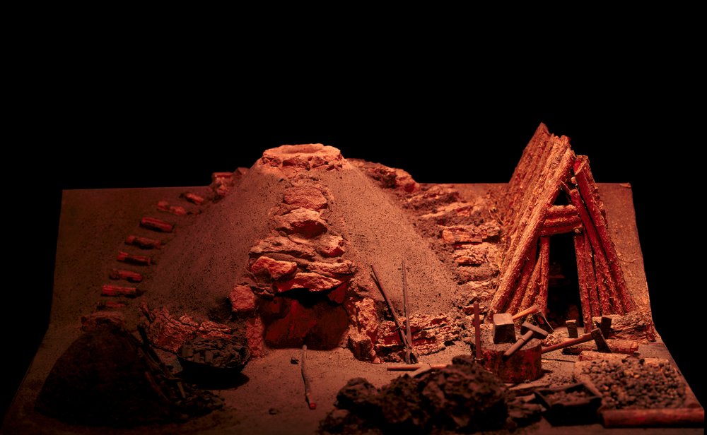 Prehistory: reconstitution of an Iron Age forge. Saint Germain en Laye ...