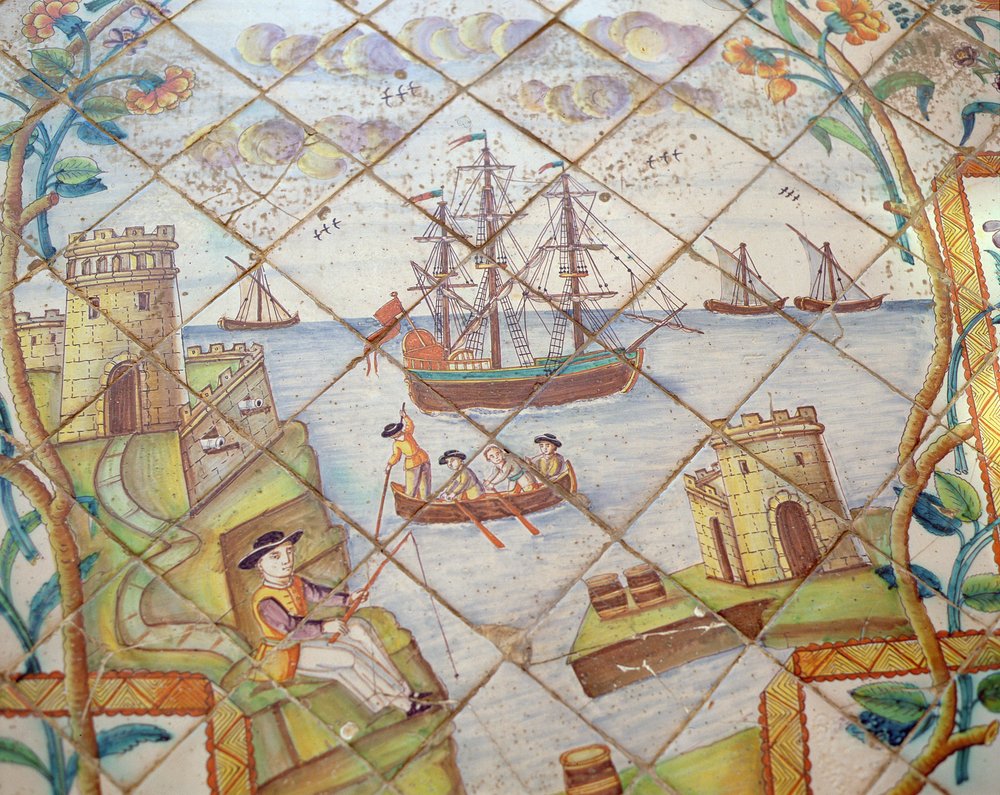 Azulejos tiles depicting a port with ships by Spanish School