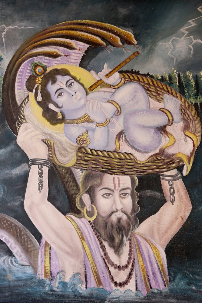 Painting in Gokul: Krishna as a baby carried over the Yamuna River by Vasudeva, India