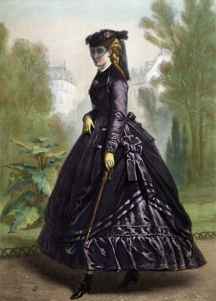 Young woman in strict and dark clothes widow