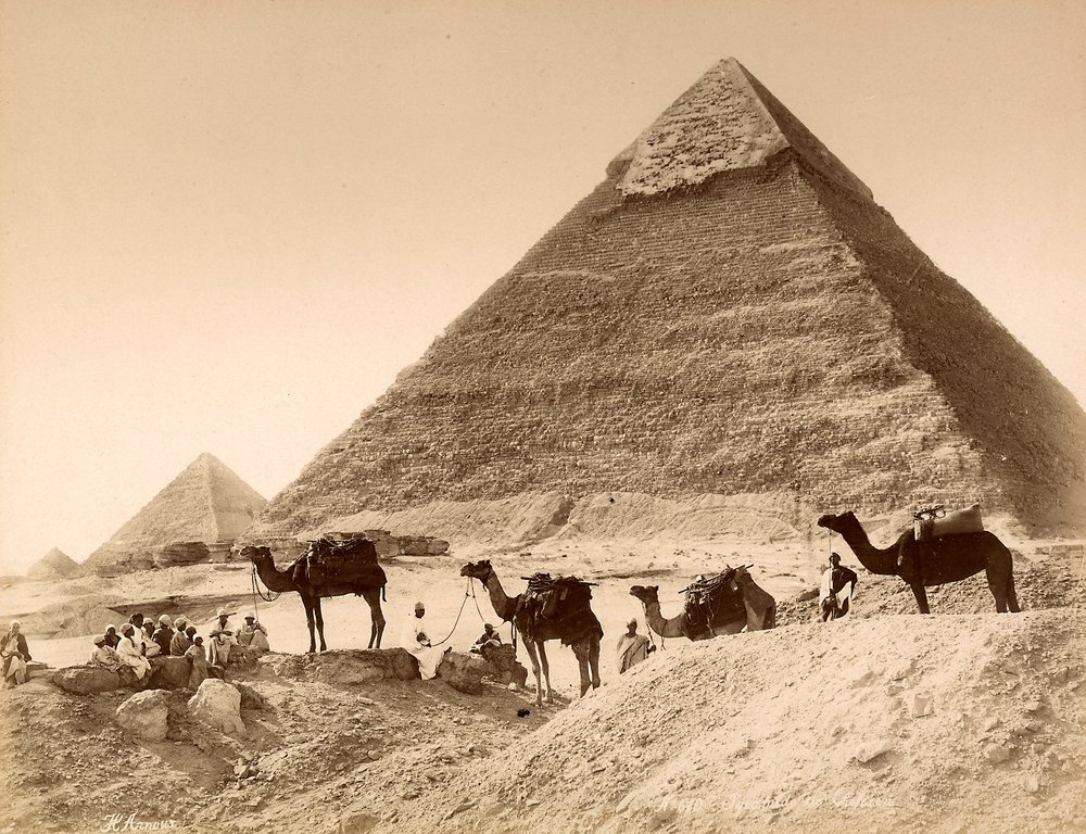 Men and camels in front of the pyramid of Chefren