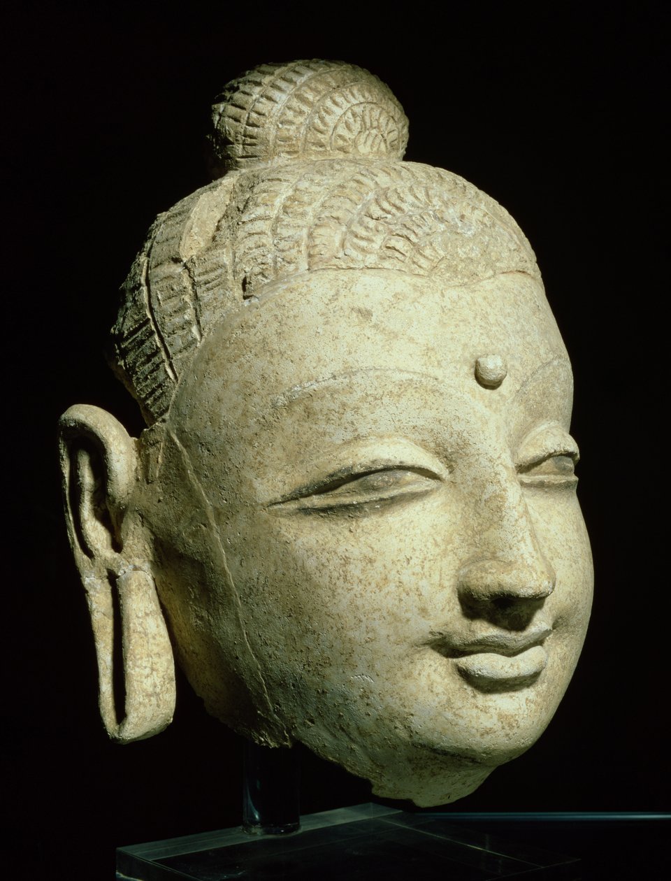 Head of a smiling Buddha, Greco-Buddhist style, from Afghanistan