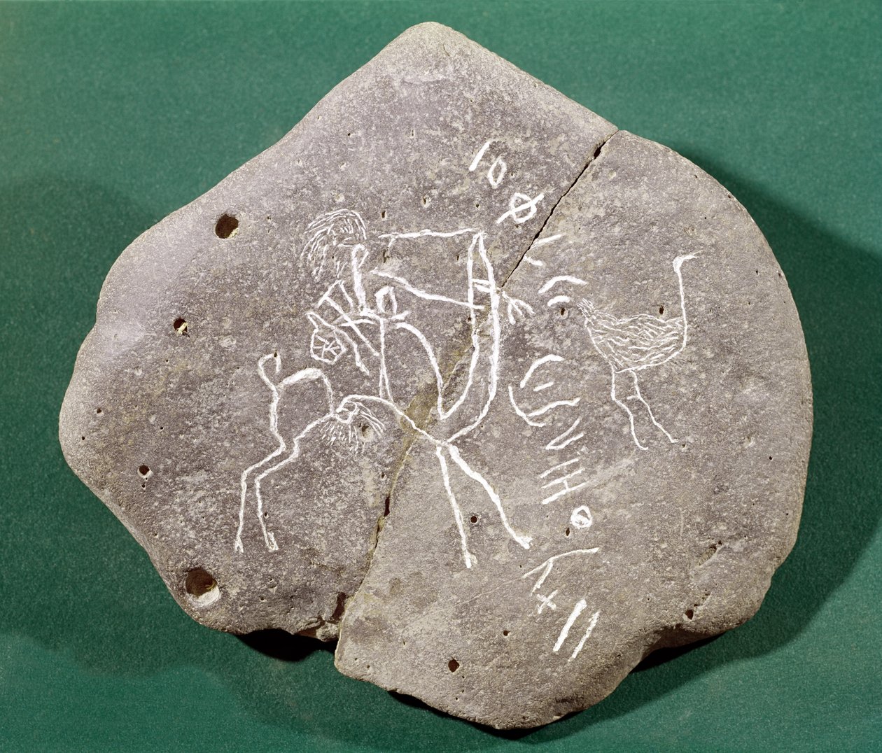 Stone inscribed with a hunter in the desert and a safaitic inscription