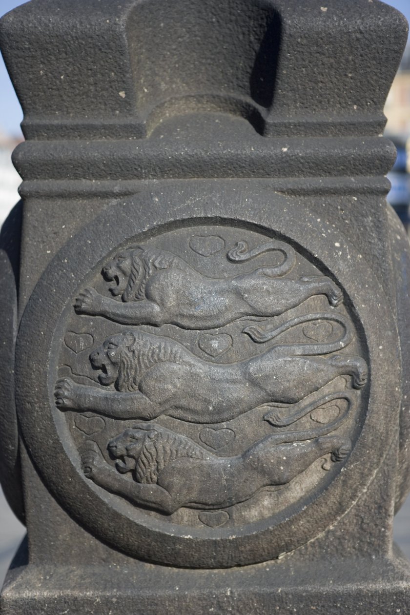 Three Lions Symbol Carved in a Stone Column in the City Hall Square
