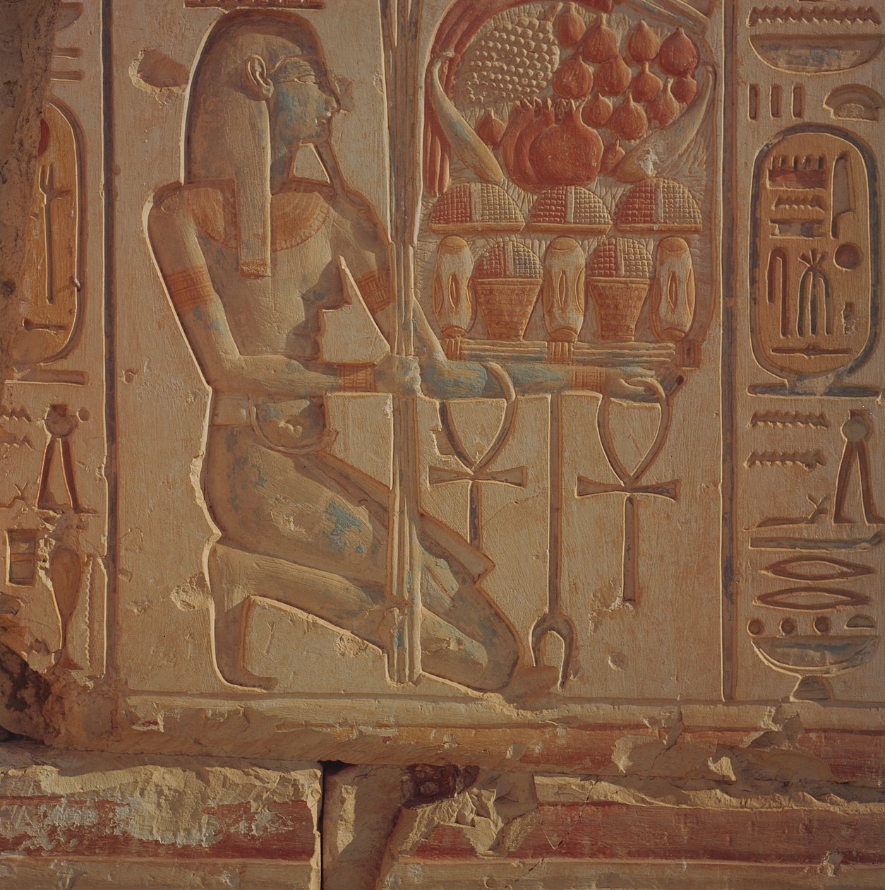 Kneeling figure presenting baskets of food, from the Temple of Ramesses ...