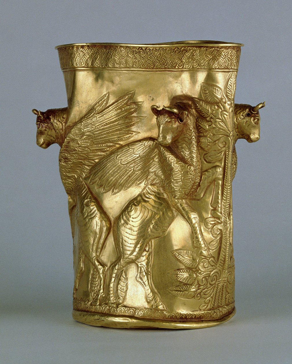 Beaker decorated with winged bulls flanking a tree, from Marlik, Iran ...