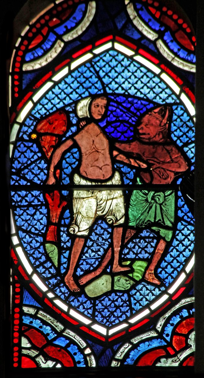 Window depicting a scene from the Prodigal Son story: he is led astray