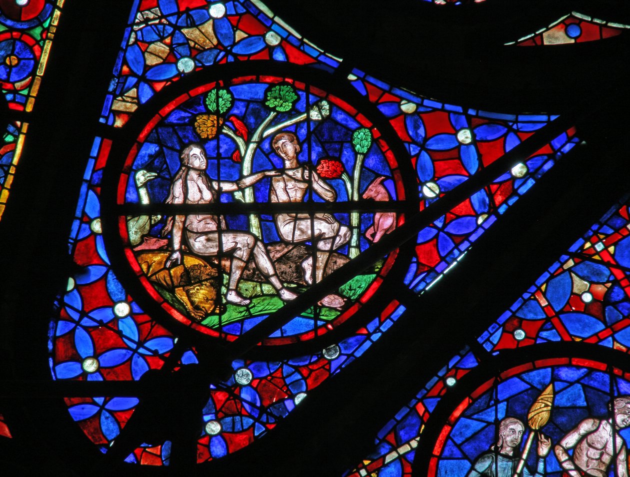 Window w115 depicting Adam and Eve under a tree with animals and birds