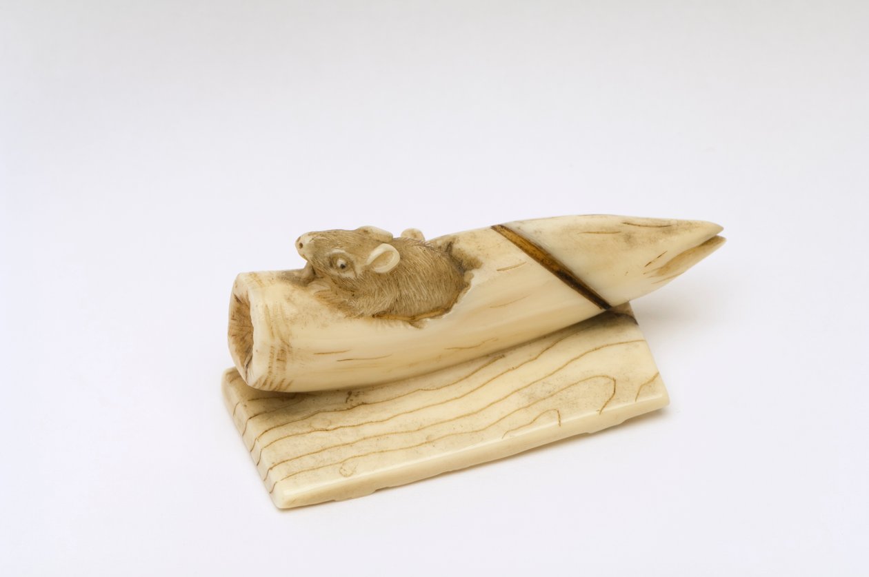 Netsuke of a mouse emerging from a bamboo shoot