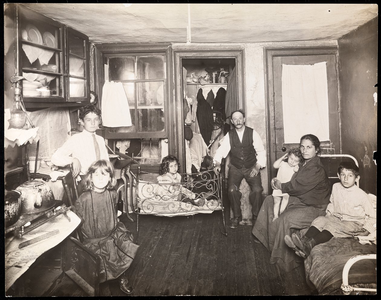 Family in Room in Tenement House by Jessie Tarbox Beals