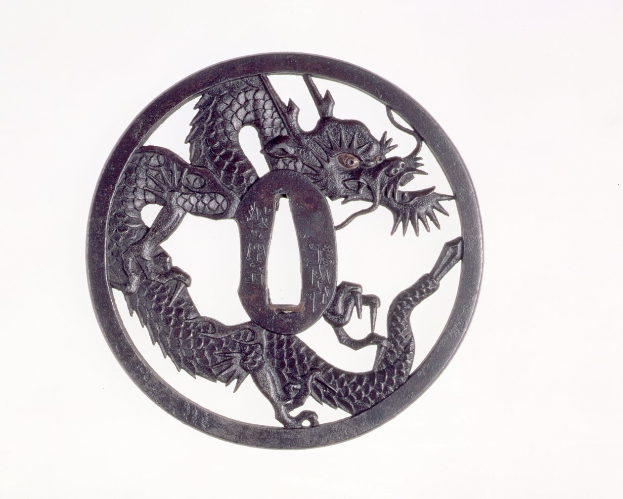 Tsuba with Cut-out Dragon by Kinai of Echizen