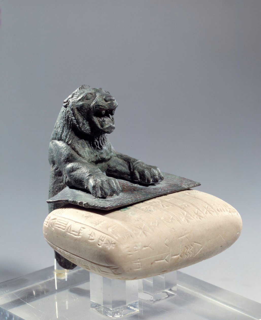 Bronze lion holding a foundation tablet in Hurrian language, written in ...