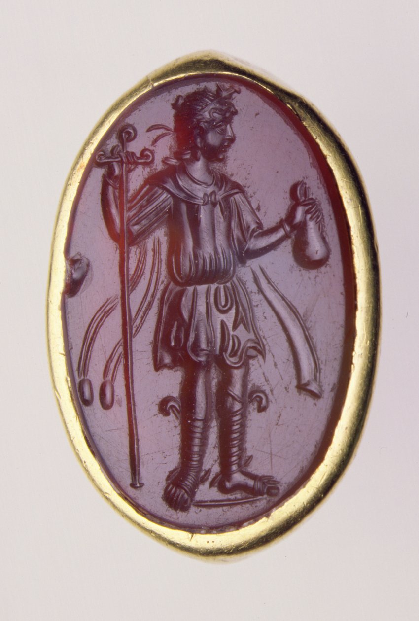 Intaglio set in a gold ring depicting young male figure